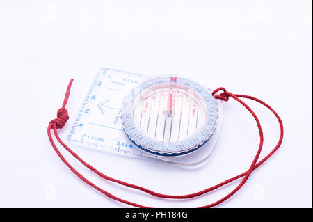 Adjustable compass with bezel and baseplate, needle pointing to ...