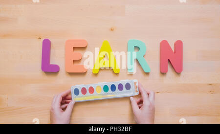 Word LEARN from multicolor wooden letters on wooden table Stock Photo ...