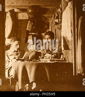 WW1 - Soldiers smoking. One soldier lights his cigarette from another's ...