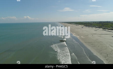 Aerial view of sandy beach Lingayen with azure water on the island ...