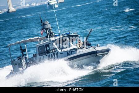 US Navy Sea Ark patrol boats are docked next to each other in ...