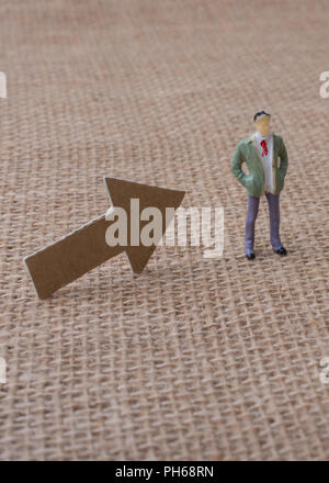 Colorful letter cubes and a calculator beside a figurine Stock Photo ...
