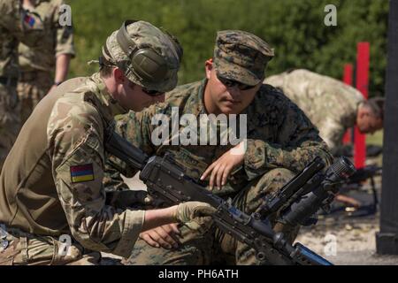 A US Marine Corps Weapons Technician Shows Off 20mm High Explosive ...