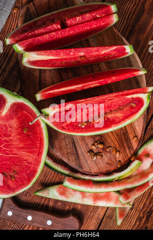 Close-up of watermelon peels on a white table, food leftovers, bio ...
