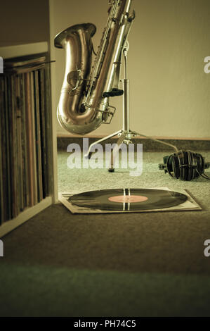 Lifestyle, Still Life with records, saxophone with headphones Stock ...