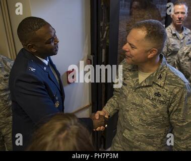 Col. Alfred Flowers Jr., 99th Medical Group commander, greets Col ...