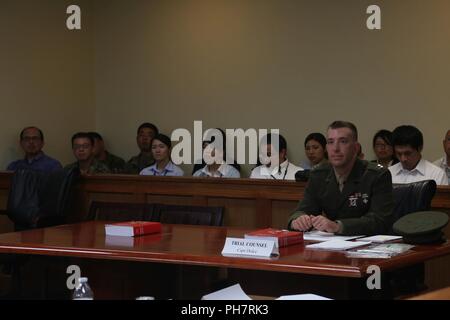 Capt. Eric Dolce, U.S. Marine Corps staff judge advocate, prepares for ...