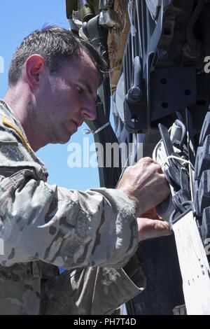 A U.S. Army Joint Airdrop Inspection rigger with the 421st ...