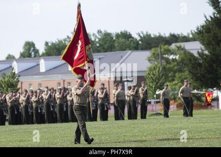 U.S. Marine Corps Maj. Scott Caton accepts a plaque on behalf of Capt ...