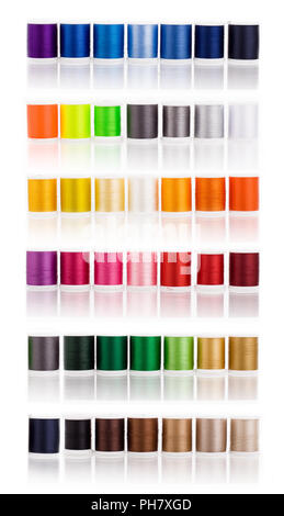 Colorful sewing threads on white background Stock Photo - Alamy