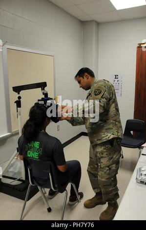 A U.S. Army Reserve soldier completes a two-mile run as part of the ...