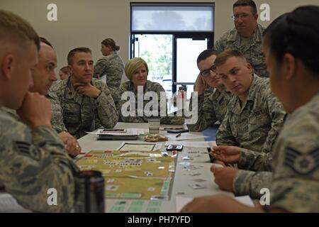 Col. Michelle Guerrero, 92nd Medical Group commander, passes the 92nd ...