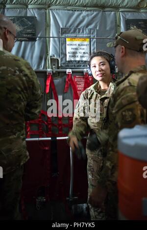 A loadmaster from the 136th Airlift Wing (AW), Fort Worth, Texas ...
