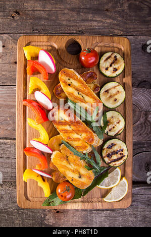 set of spices on wooden background, pomegranate, pine nut, walnut ...