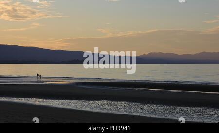 Pohara Beach at sunset. Summer scene in New Zealand Stock Photo - Alamy