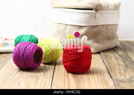 A couple of cotton yarns and decorative pins Stock Photo - Alamy