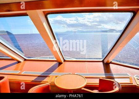 Empty yacht interior with chair and table set for dinner Stock Photo ...