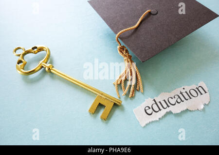Graduation cap and key Stock Photo - Alamy
