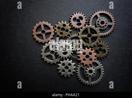 Metal gears on black background Stock Photo - Alamy