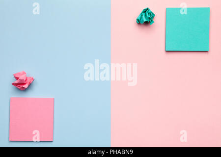 Sticky notes with crumbled paper balls on pastel background. Minimal ...
