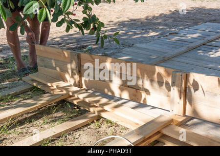Formwork for fence. Construction of a wooden fence Stock Photo - Alamy