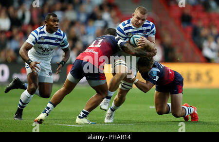 Bath's Sam Underhill is tackled by Bristol's Ian Madigan and Alapati ...