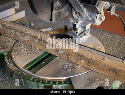 Closeup of wood cutting table with electric circular saw. Professional ...