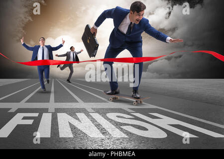 Businessman beating competition on skateboard Stock Photo - Alamy