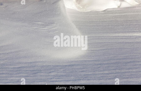 beautiful uneven snowdrift of pure snow, illuminated by sunlight Stock ...