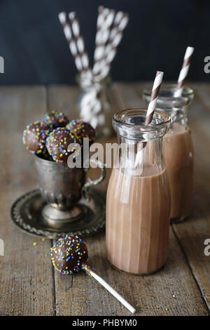 Tasty cake pops on wooden background Stock Photo - Alamy