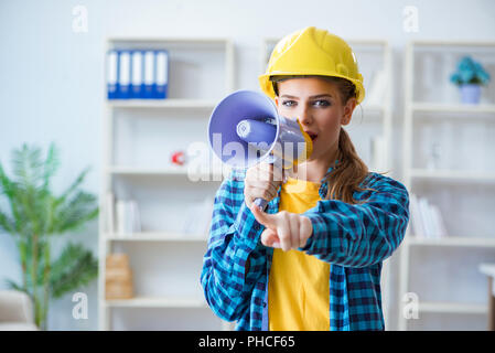 Angry building supervisor with megaphone Stock Photo - Alamy
