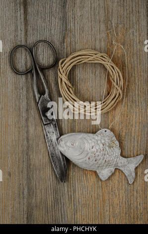 old scissors, glasses and hank of packthread on wooden background Stock ...