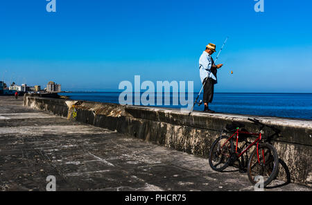 Cuban fishing on sea wall, Malecon, Vedado, Havana, Cuba Stock Photo ...