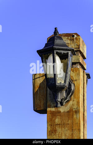 Old wooden street light pole with internet router Stock Photo - Alamy