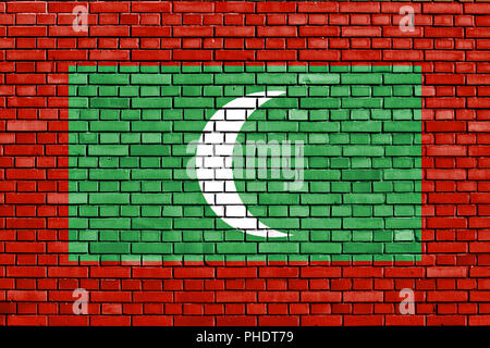 Maldives national flag painted on textured wall mural background Stock ...
