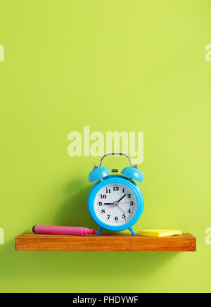 notepad and book on shelf at wall background surface Stock Photo - Alamy