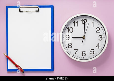 wall clock at wooden background surface Stock Photo - Alamy