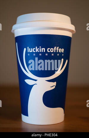 1 Septembre 2018, Wuhan China : A coffee cup of Luckin Coffee on wooden ...