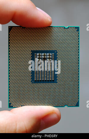 Male hand is holding a cpu, close up; Computer technology Stock Photo ...