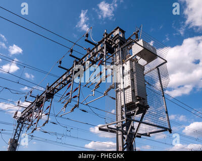 Overhead railway electricity supply wire, cantilever arm and support mast close up on the West ...