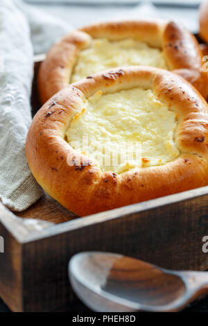 cottage cheese in a small brown bowl on a wooden background Stock Photo ...