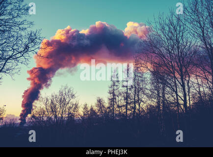 Rising smoke, fog and evening light between fields, temples and pagodas ...
