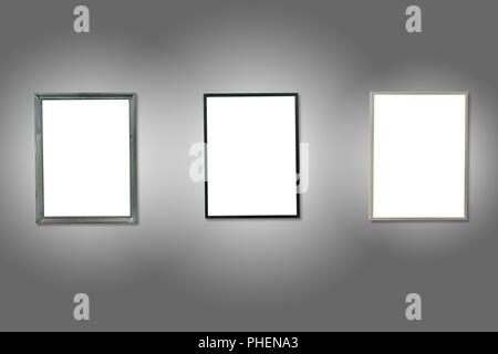 Three white wooden photo frames on the decorated wall Stock Photo - Alamy