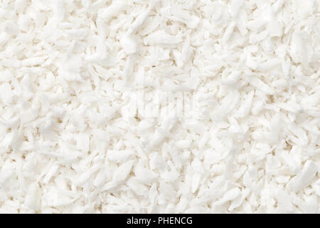 The texture of coconut flakes as a background. A close shot of a ...