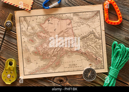 Travel items for hiking over wooden background Stock Photo - Alamy