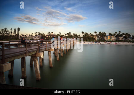 Naples Pier on the beach at sunset Stock Photo - Alamy