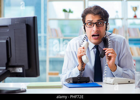 Unhappy angry call center worker frustrated with workload Stock Photo ...