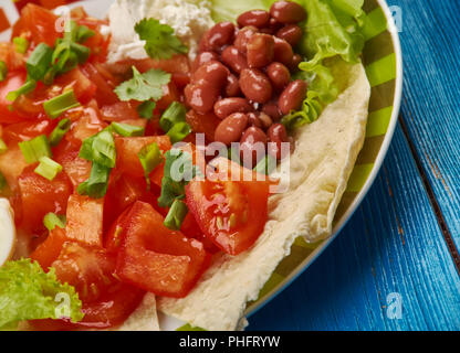 East African cuisine - Timatim Tomato Salad, Traditional assorted ...