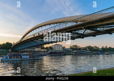 Side view of Father Bernatek Footbridge across the Wisla river. Krakow ...