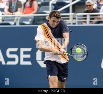 Taylor Fritz of the U.S. returns the ball to Germany's Daniel Altmaier ...